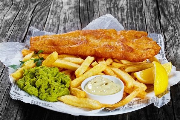 What do British people dip their fish and chips in?