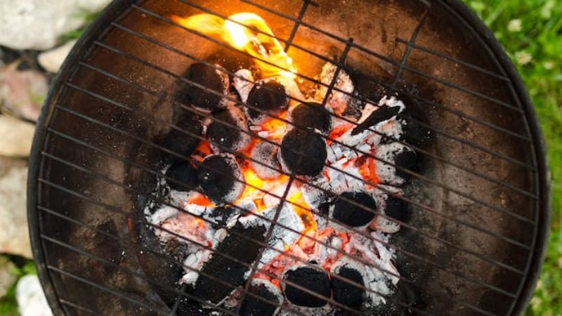 What do I do if my charcoal grill is too hot?