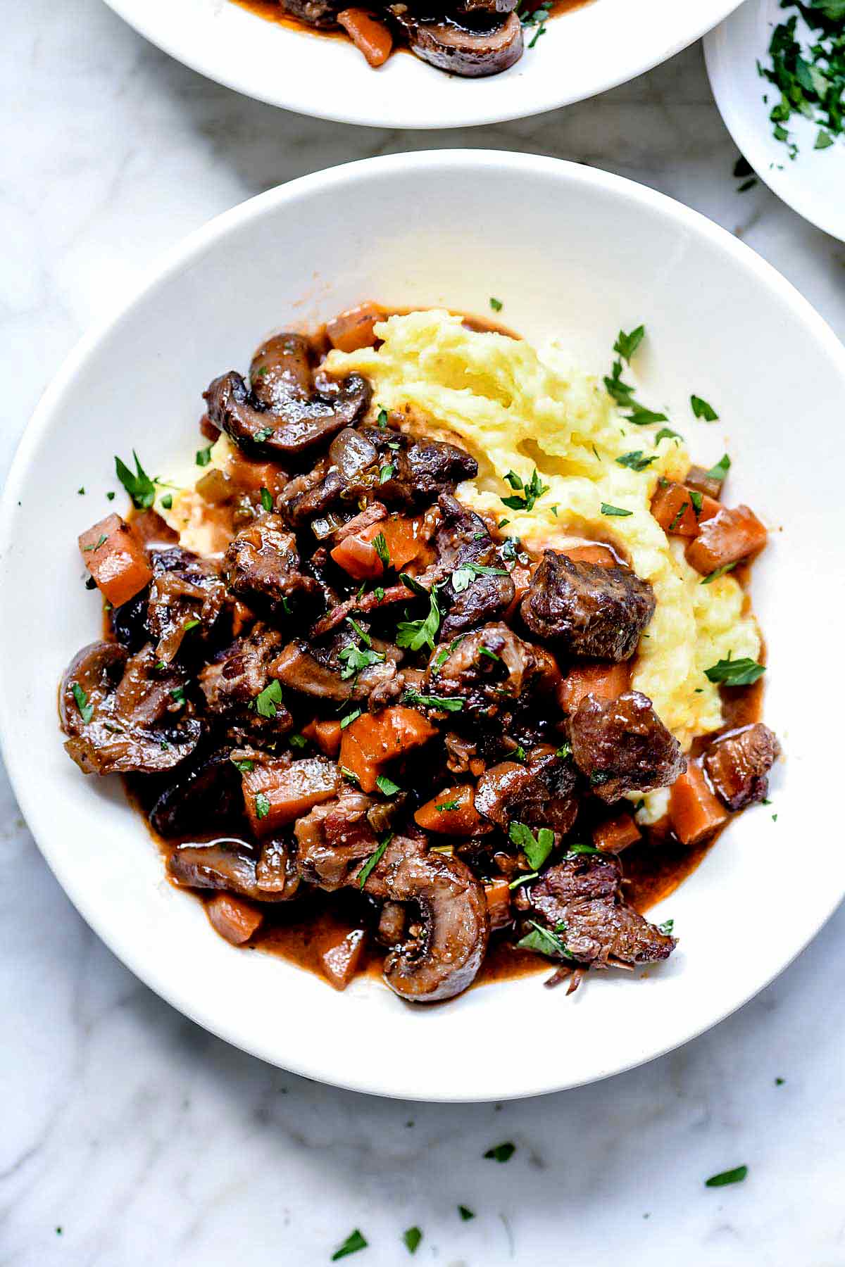 What do the French serve with beef bourguignon?