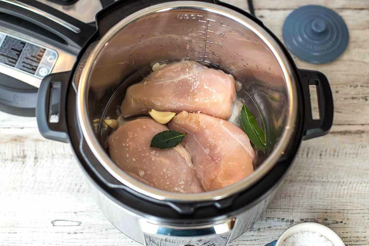 What do you do with the liquid after cooking a chicken in the Instant Pot?