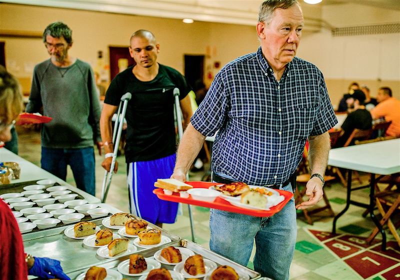 What does a soup kitchen serve hungry people?