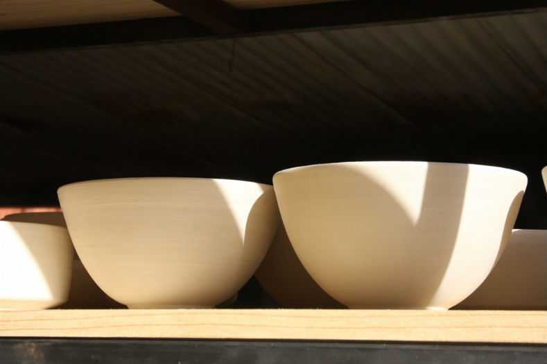 What does Bisqueware mean in ceramics?