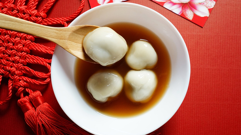 What does glutinous rice ball symbolize?