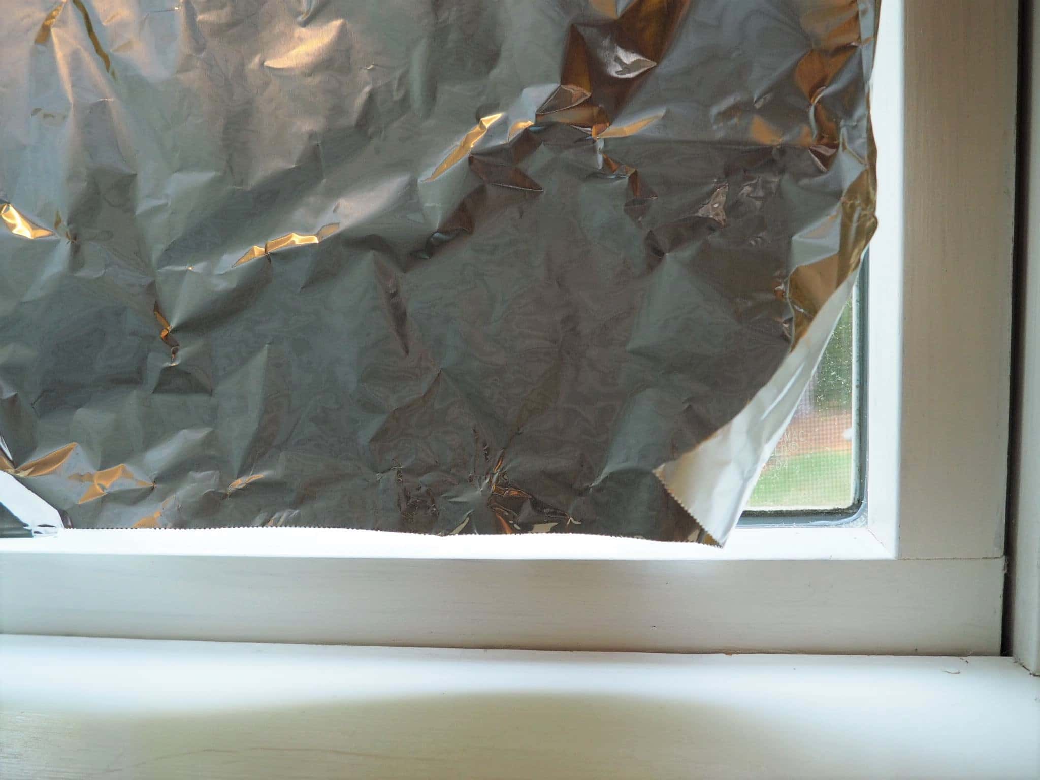 What does putting aluminum foil on windows do?