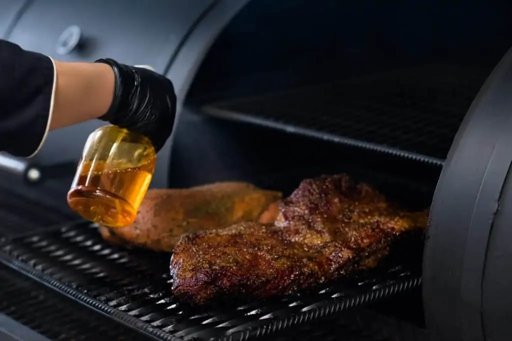 What does spritzing a brisket do?