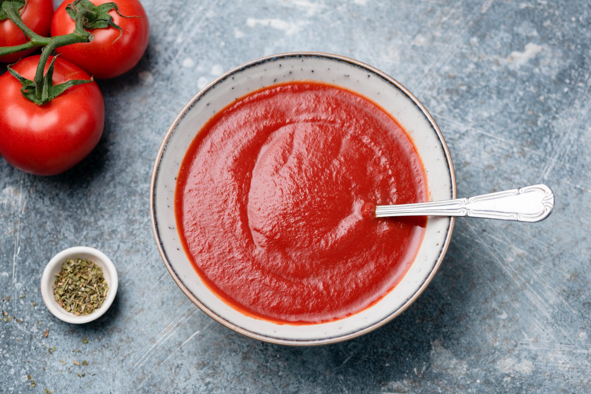 What does tomato puree add to a dish?