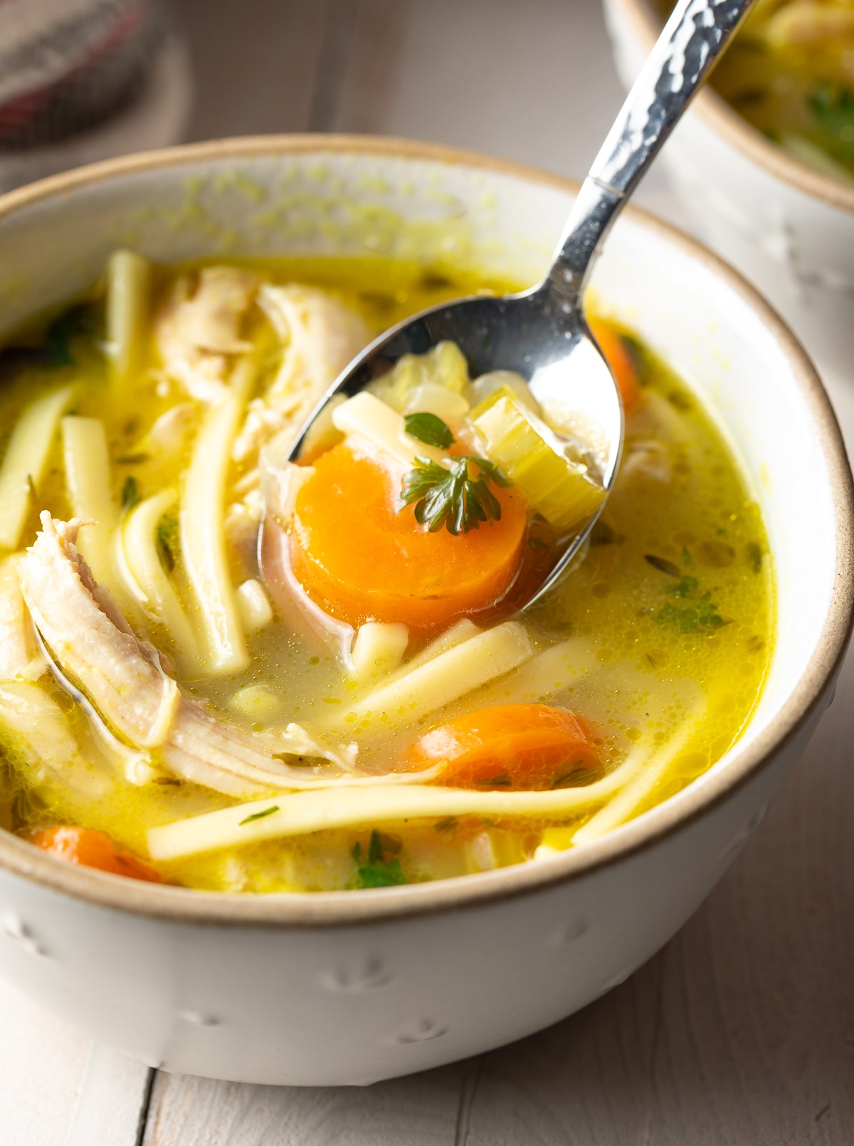 What gives chicken soup its yellow color?