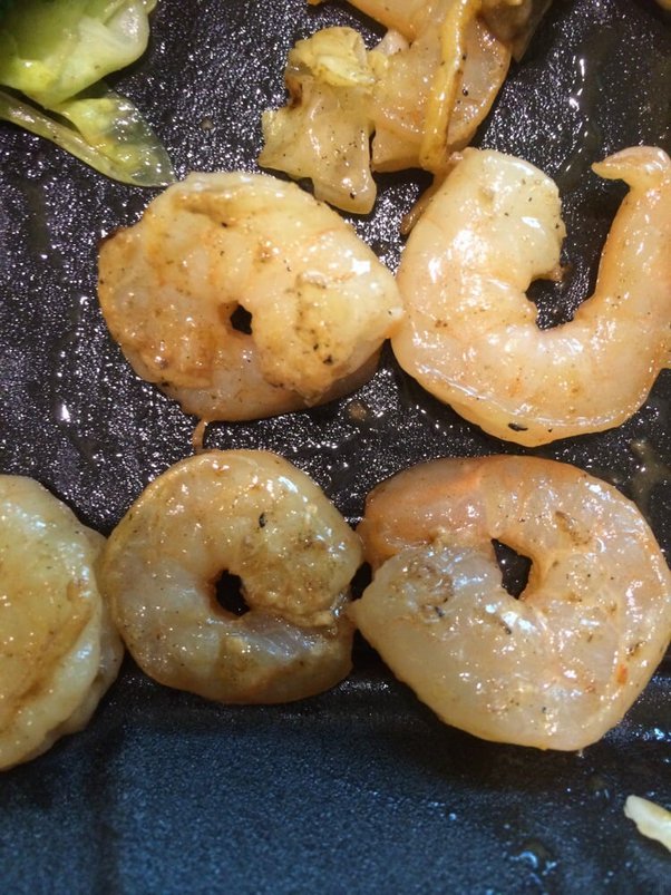 What happens if shrimp is not cooked properly?