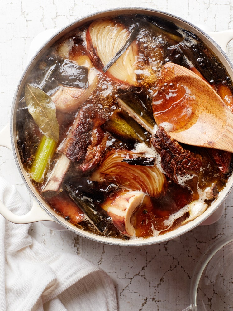 What happens to beef broth when cooked with bones?