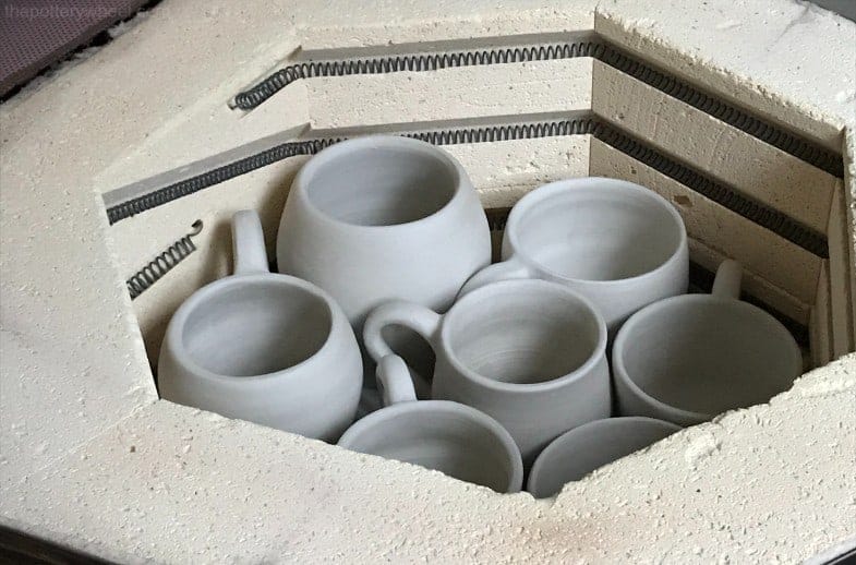What happens to clay when it is bisque fired?