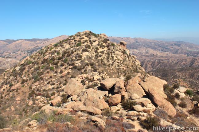 What is another word for rocky peak?