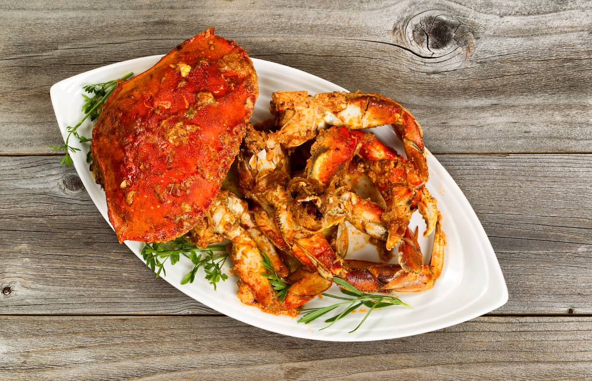 What is the best way to reheat Dungeness crab?