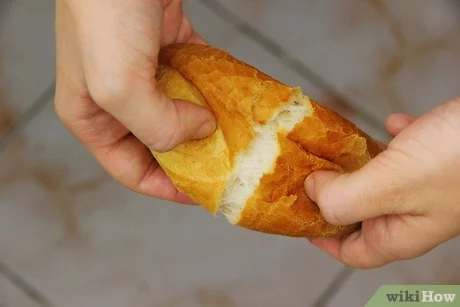 What is the proper way to eat a baguette?