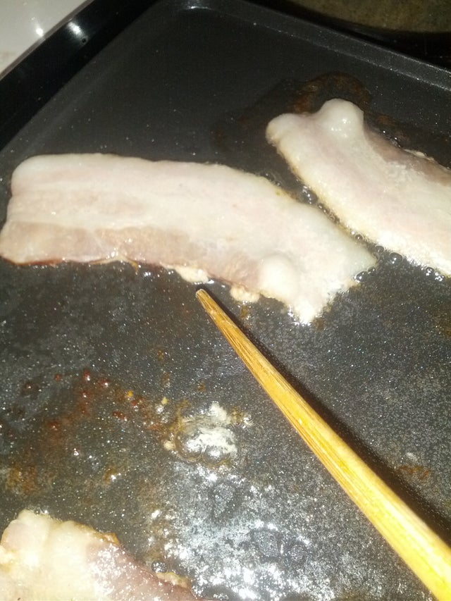 What is the white stuff that comes out of bacon when you fry it?