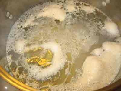 What is the white stuff that floats when boiling chicken?