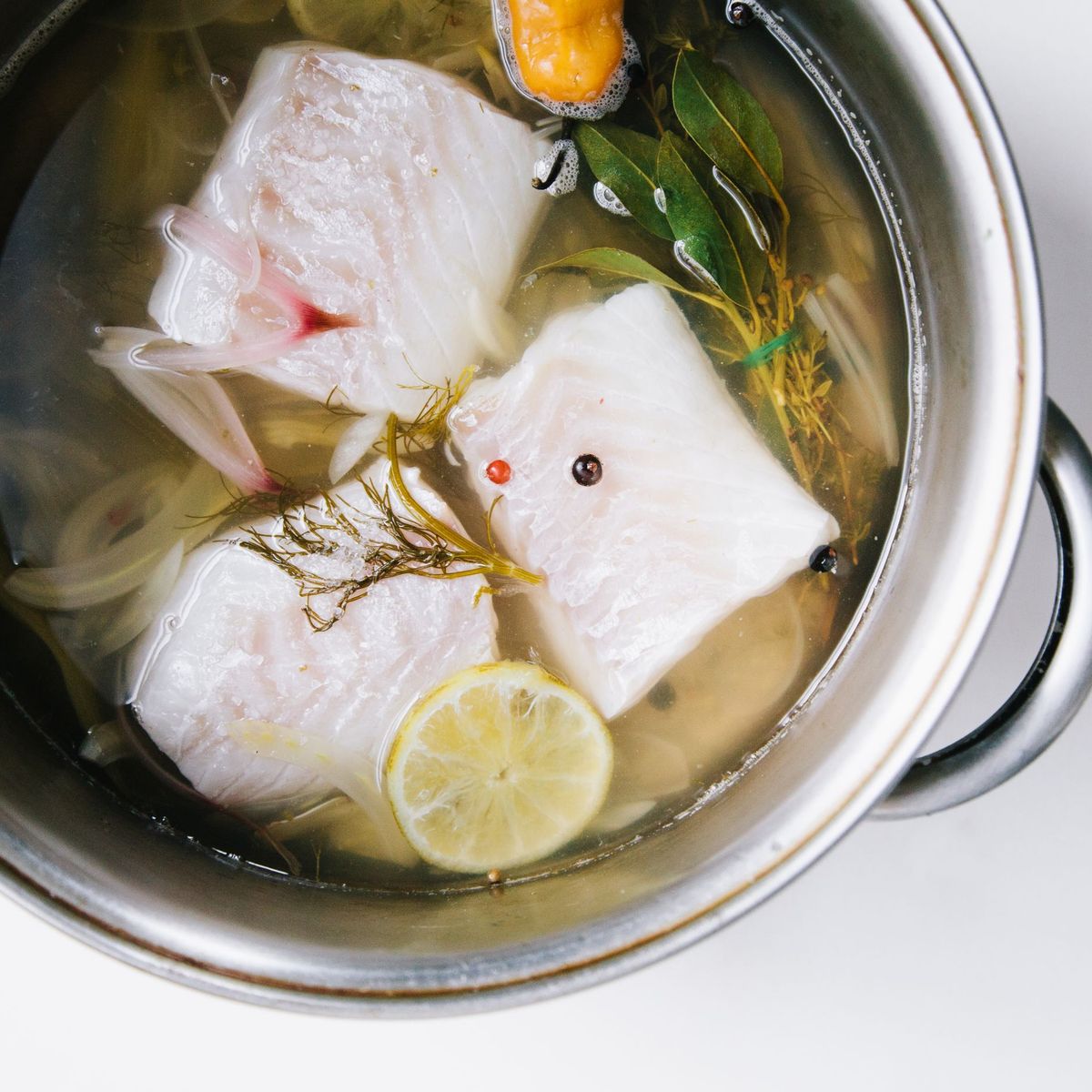 What liquids can you poach fish in?