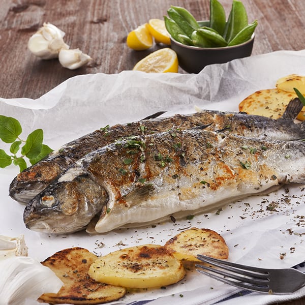 What method of cooking is best for large and fatty fish?