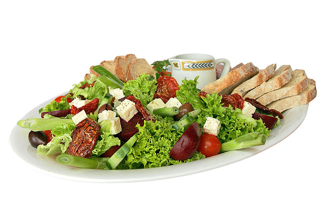 What salad is known as a side salad and it accompanies the main course?