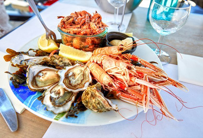 What shellfish has the least amount of cholesterol?