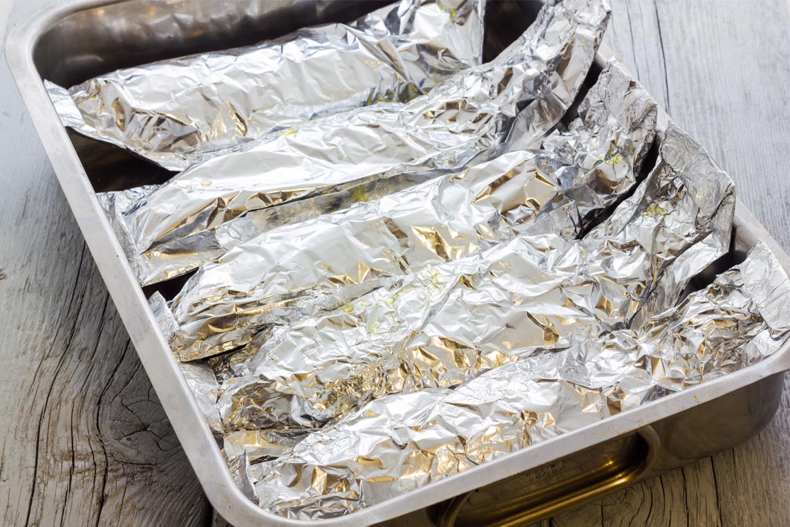 What side of the aluminum foil should be up when cooking?