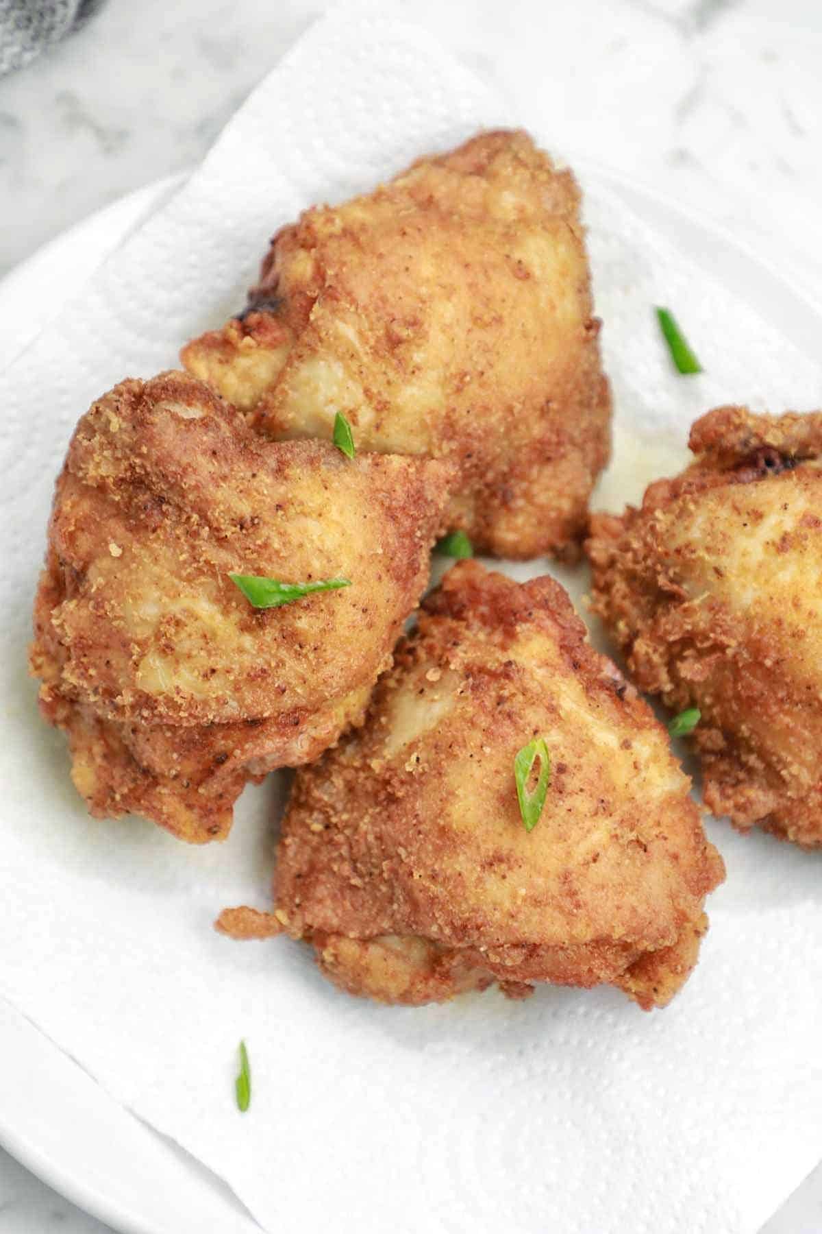 What temperature do you deep fry bone in chicken thighs?