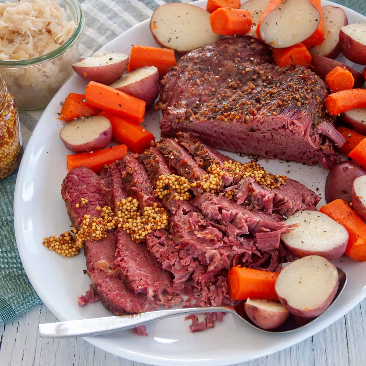 What temperature does corned beef fall apart?