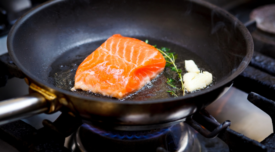 When sauteing or pan frying fish it is best to?