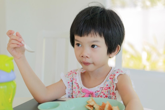 When should a child stop eating before bed?