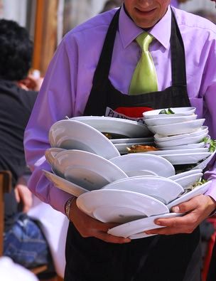 When should a waiter clear a table?