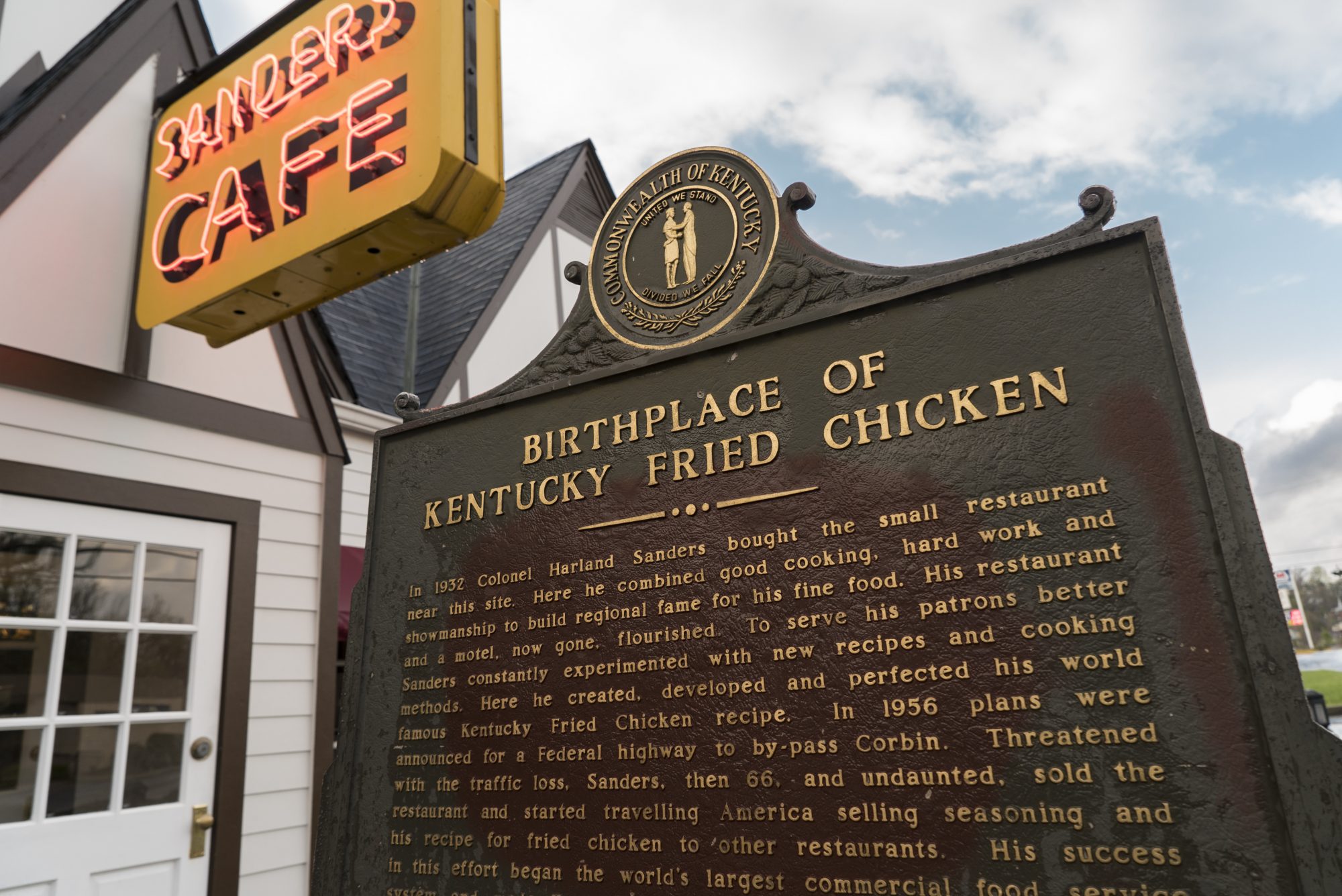 Where did Colonel Sanders start selling fried chicken?