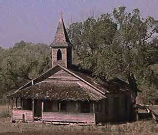 Where has Johnny gone when Ponyboy wakes up in the church?