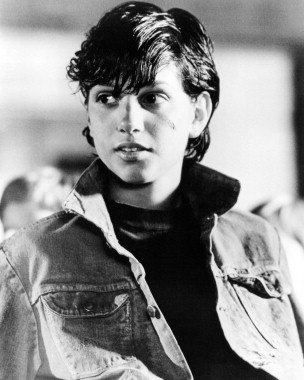 Who does Johnny fall in love with in the outsiders?