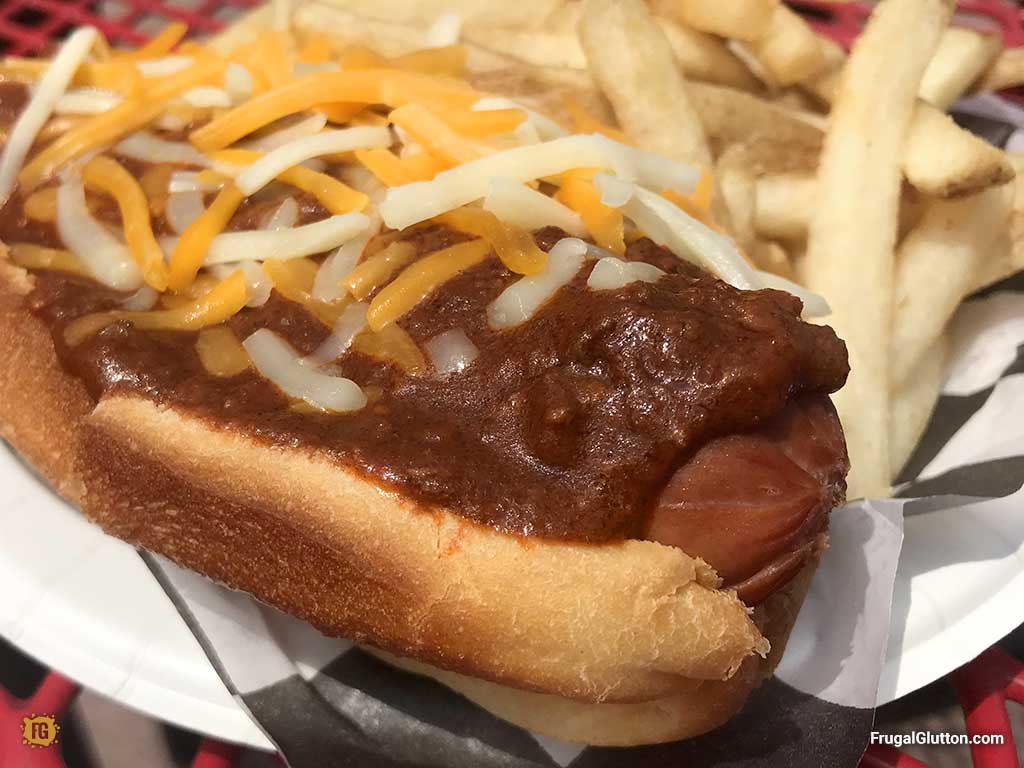 Who first put chili on hot dogs?