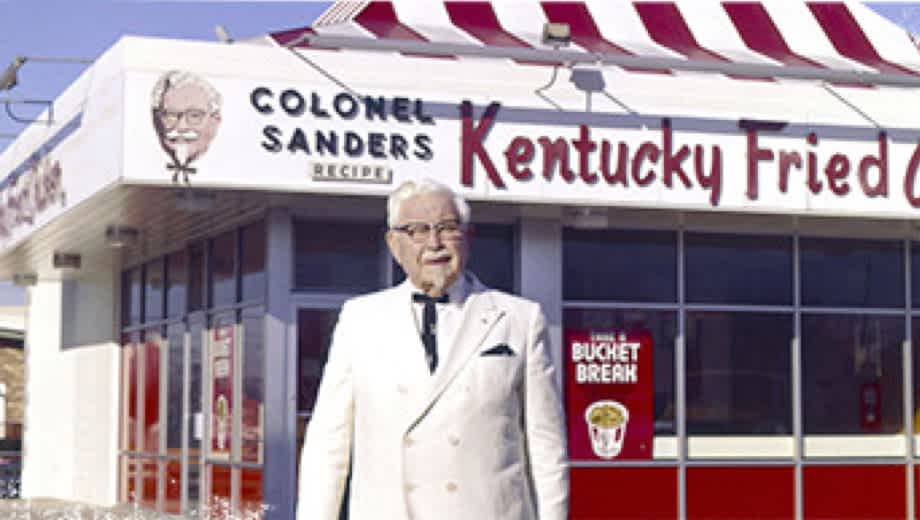 Who was the first franchisee of Kentucky Fried Chicken?
