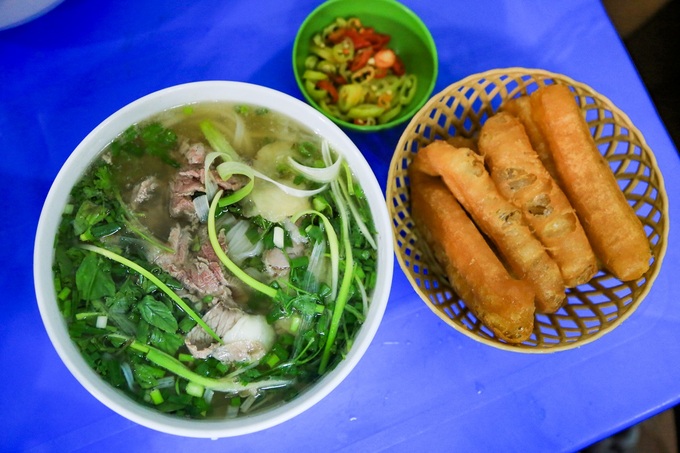 Why are the pho stalls outlawed now?