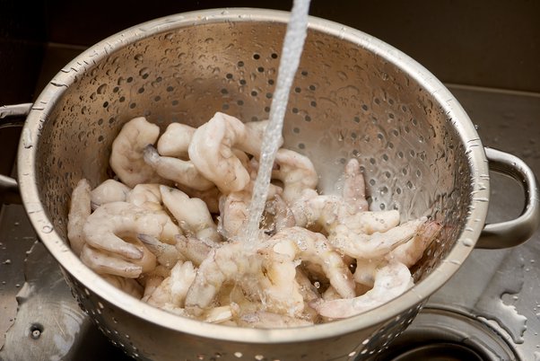 Why can't I thaw shrimp under running water?