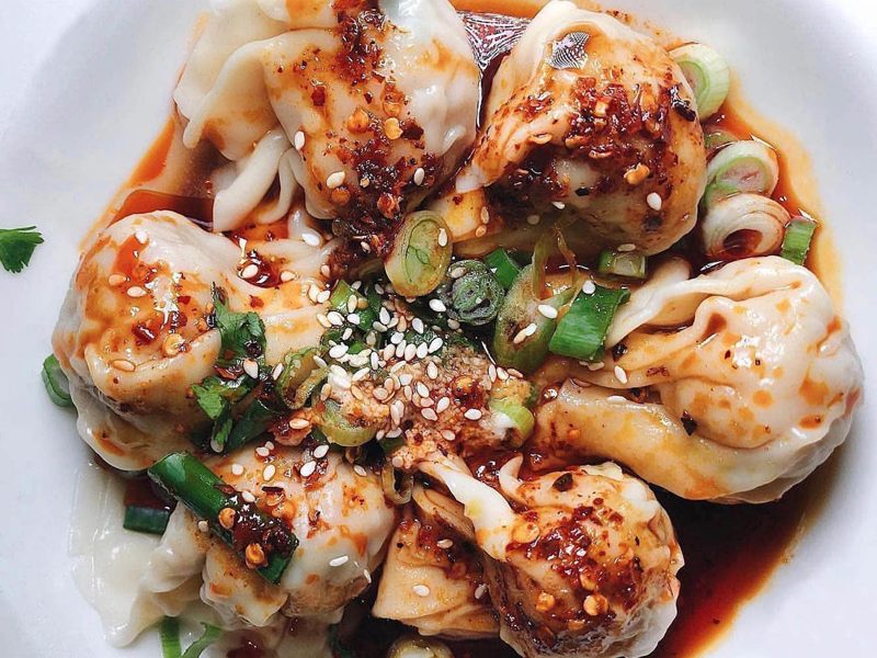 Why do dumplings Symbolise wealth in Chinese culture?