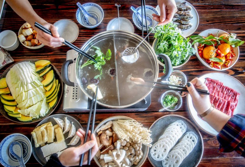 Why do people eat hotpot during Chinese New Year?