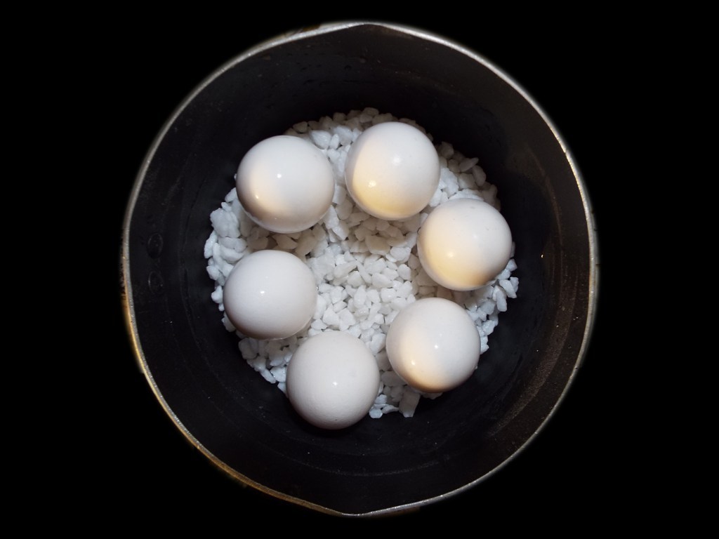 Why do people put stones in boiling eggs?