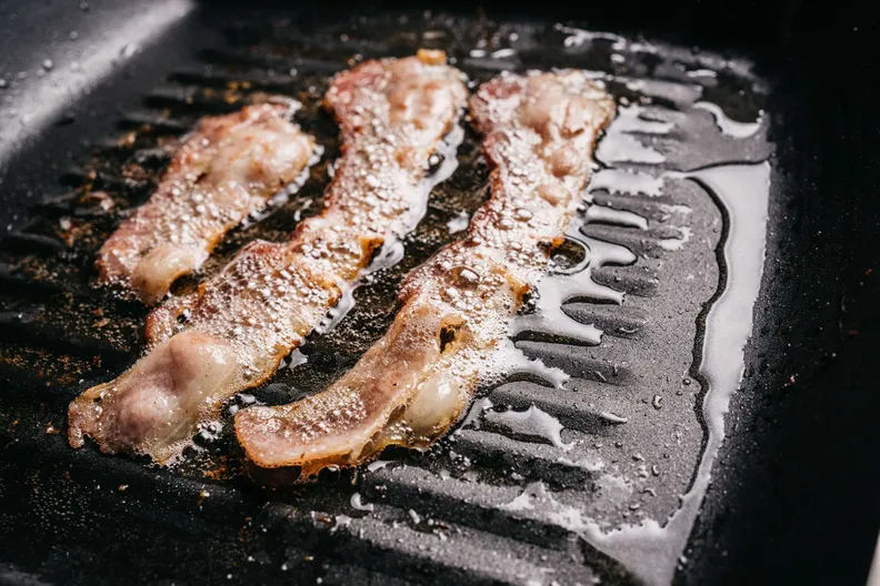 Why does bacon go grey when cooked?