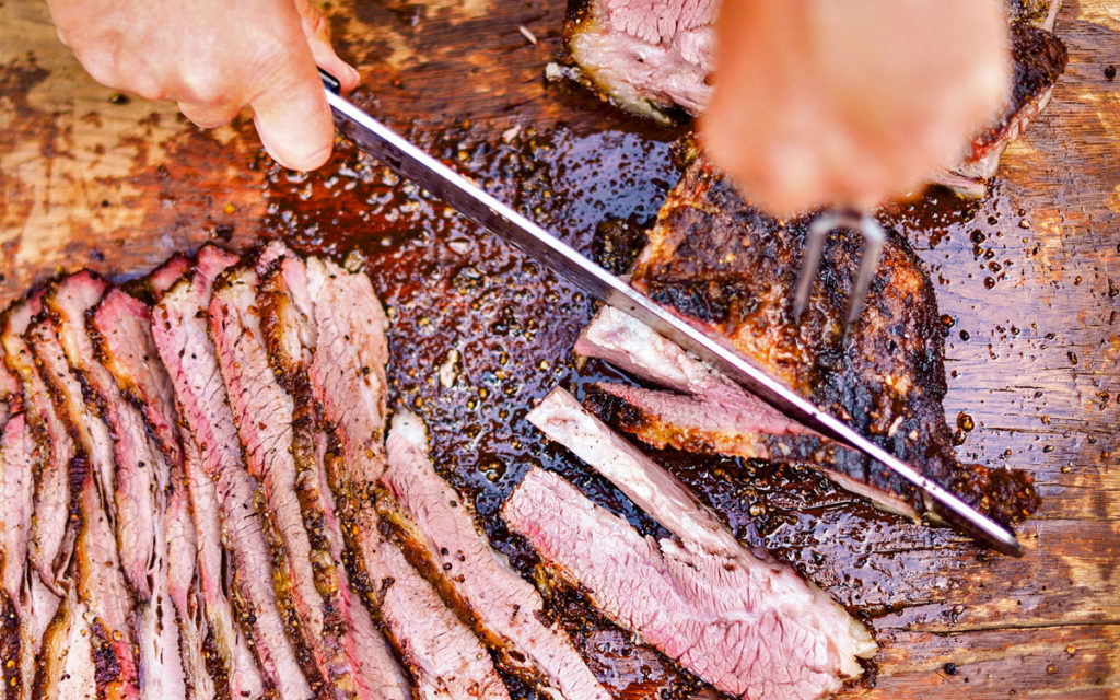 Why does brisket need to cool before slicing?