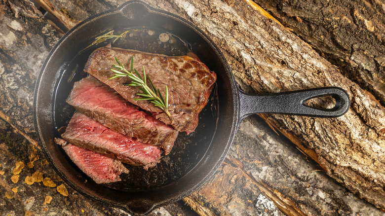 Why does my steak stick to the cast iron pan?