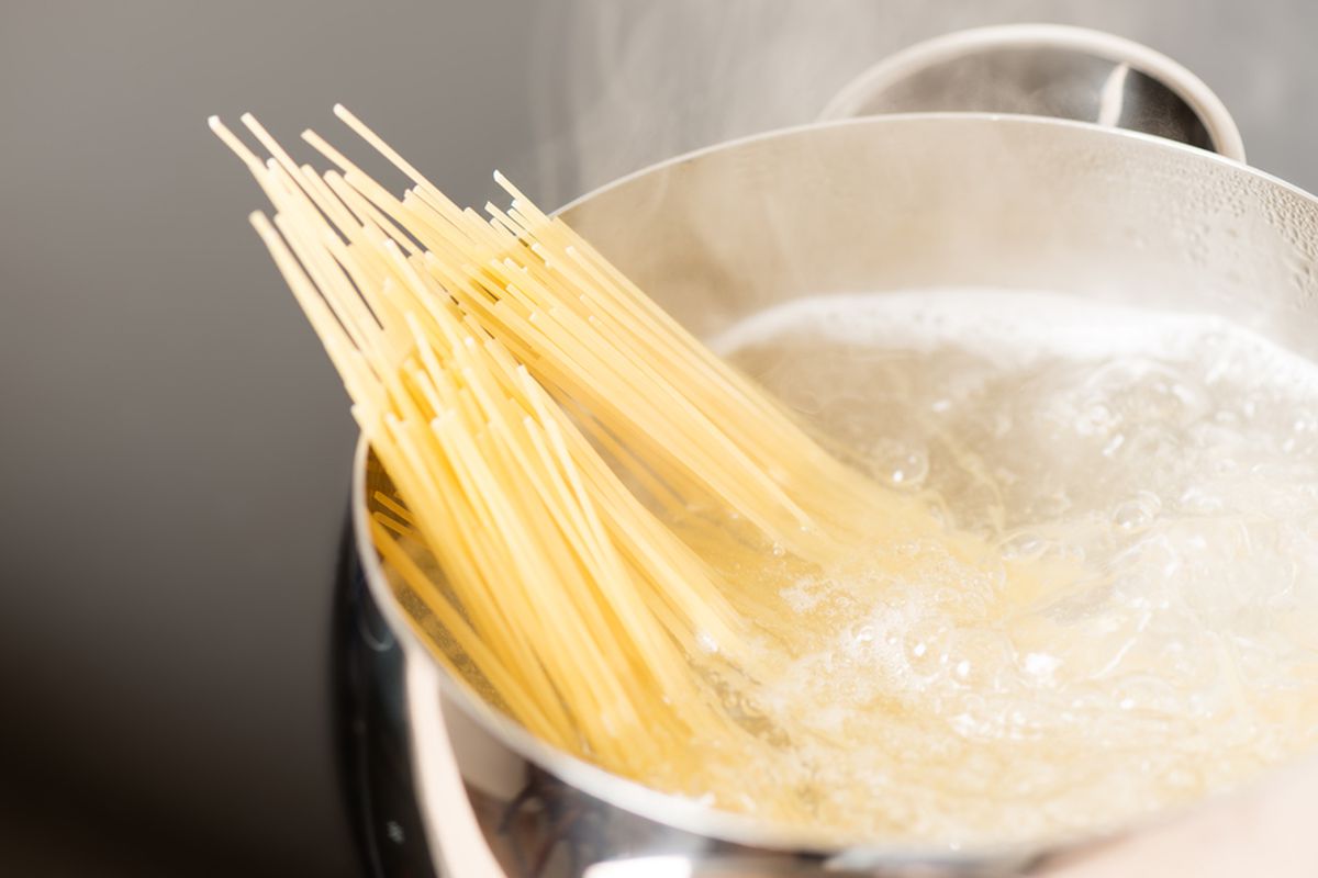 Why does pasta cook faster in boiling water?