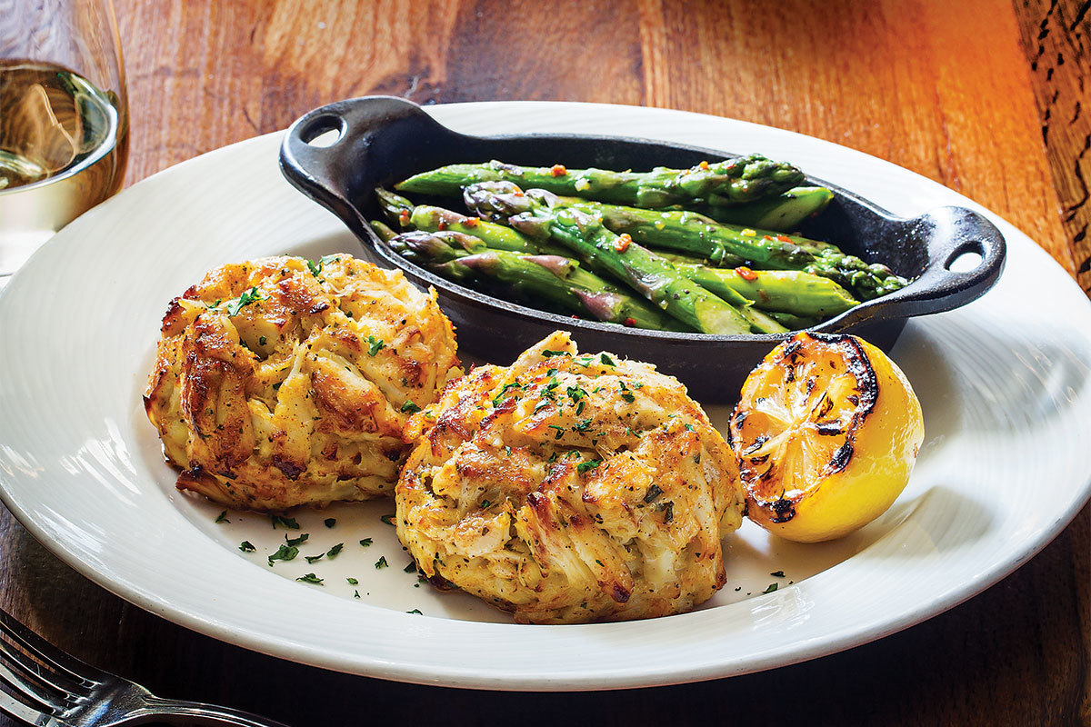 Why is Baltimore known for crab cakes?