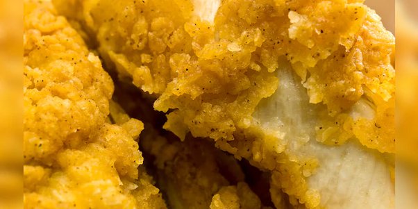 Why is fried fish often coated in flour?