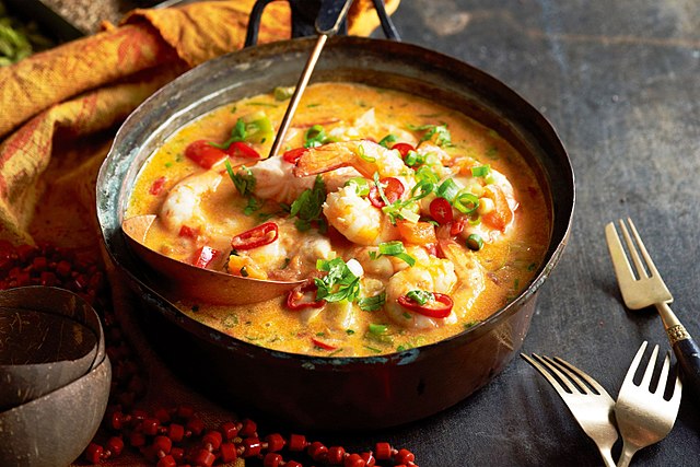 Why is moqueca popular in Brazil?
