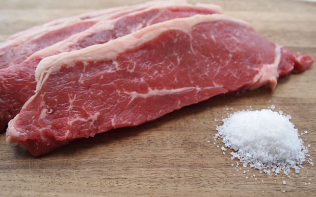 Why should you not salt meat before cooking?